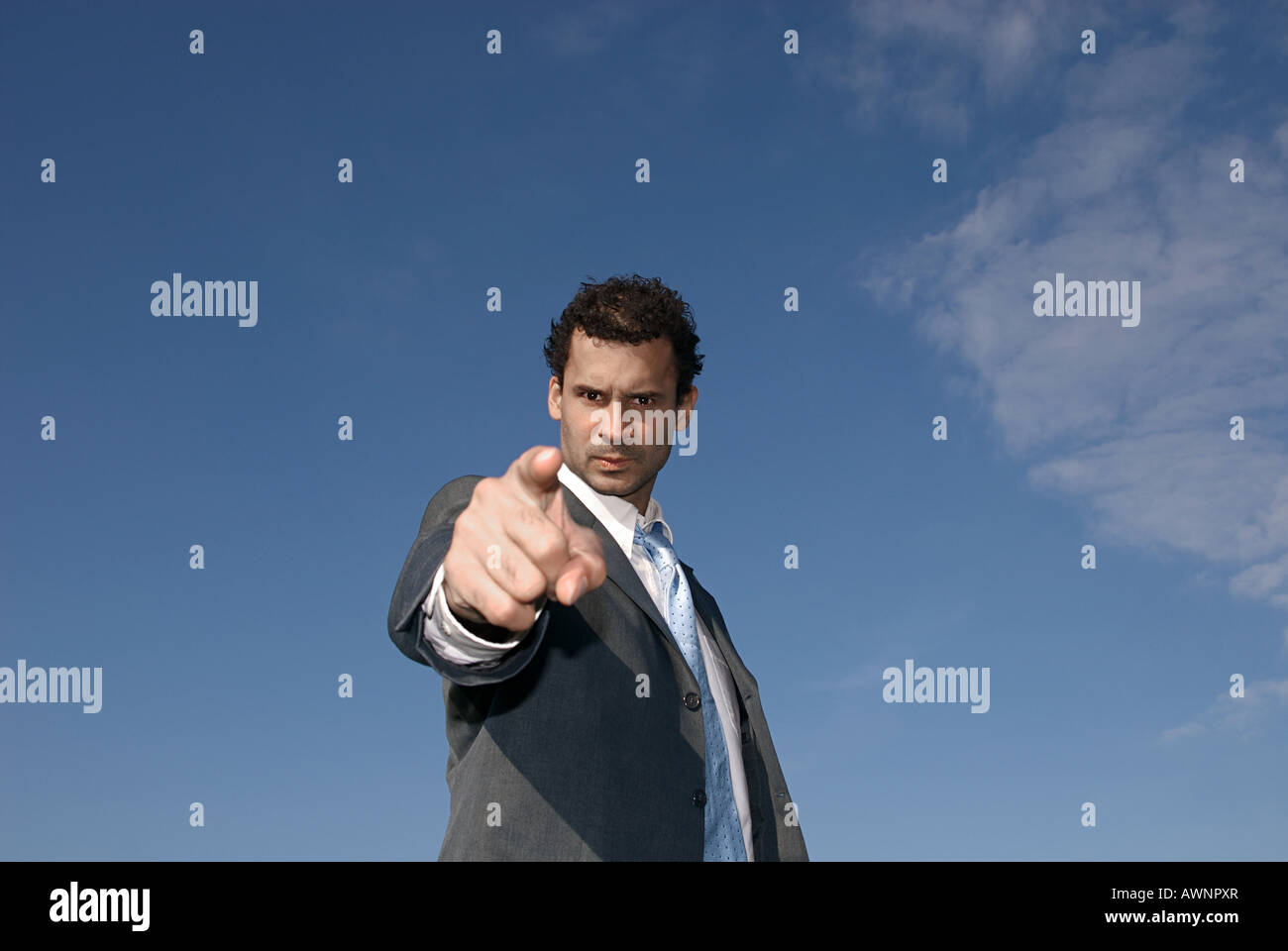 An angry businessman pointing Stock Photo - Alamy