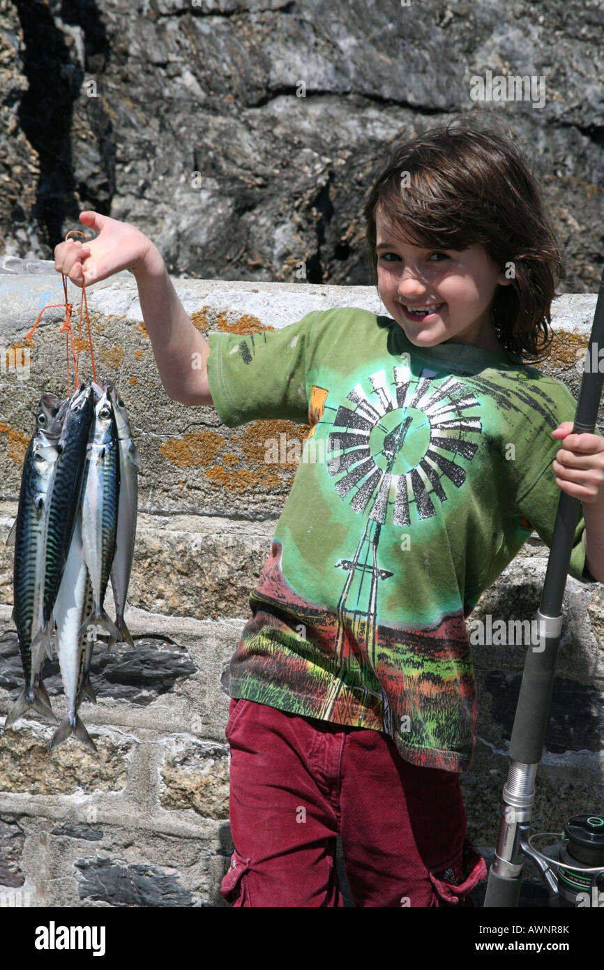Girl with fishing rod and mackerel catch Stock Photo - Alamy