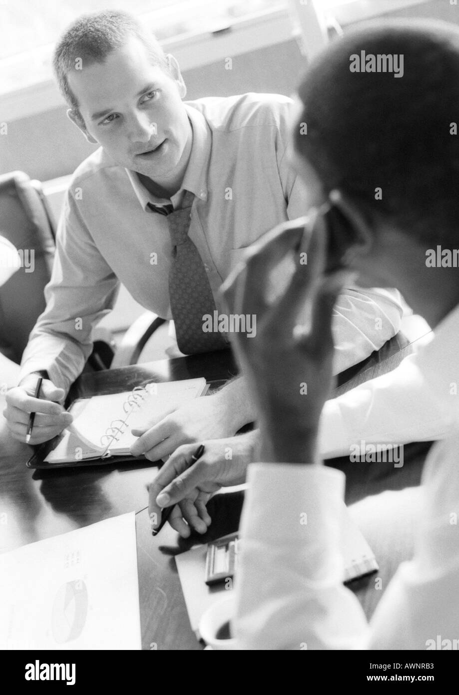 Two people using mobile Black and White Stock Photos & Images - Alamy