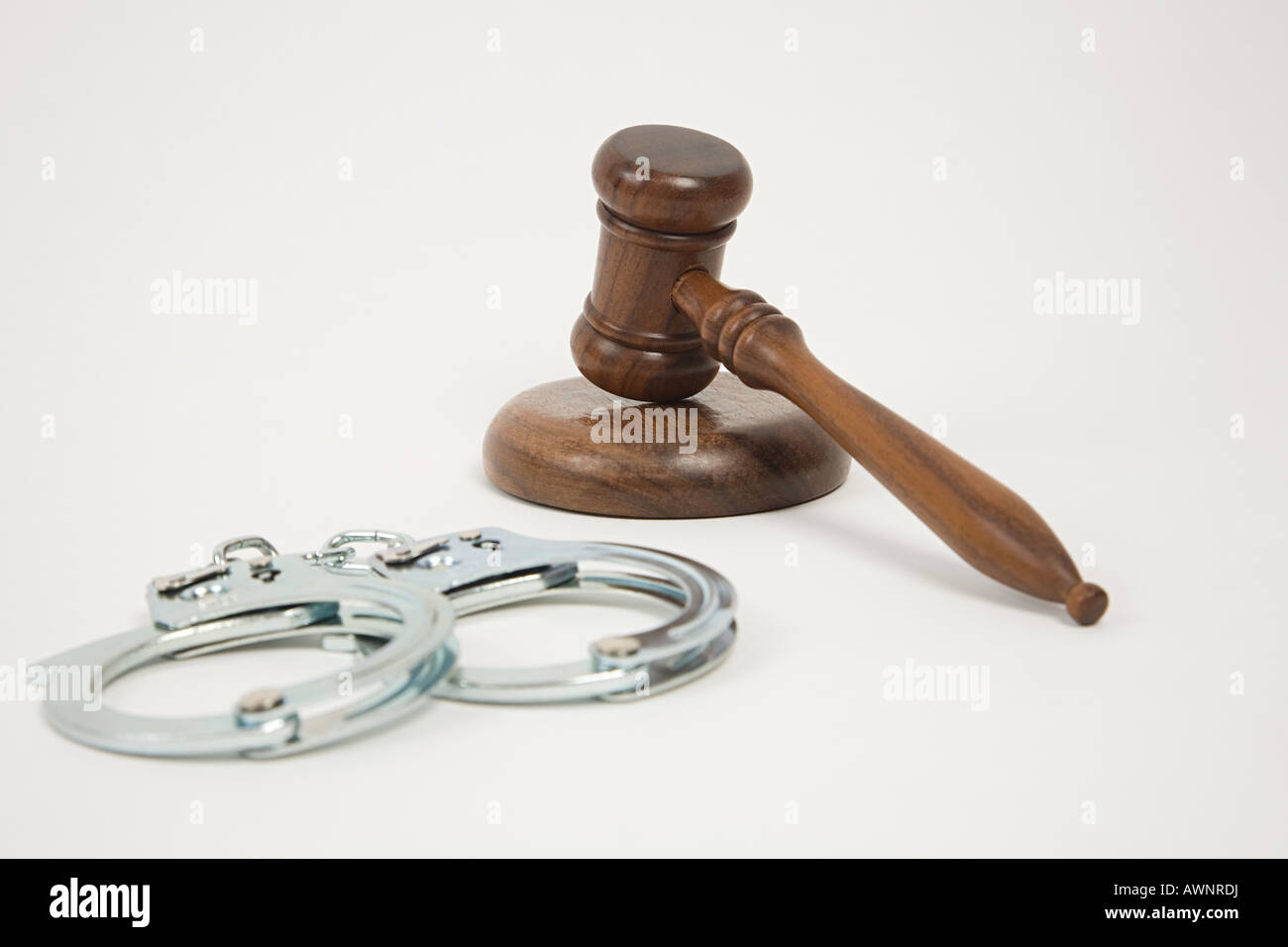 A gavel and handcuffs Stock Photo - Alamy
