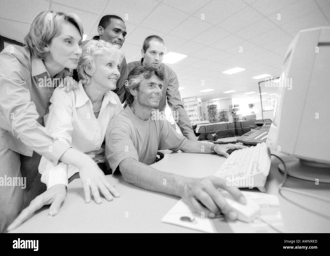 Group people watching computer screen Black and White Stock Photos ...