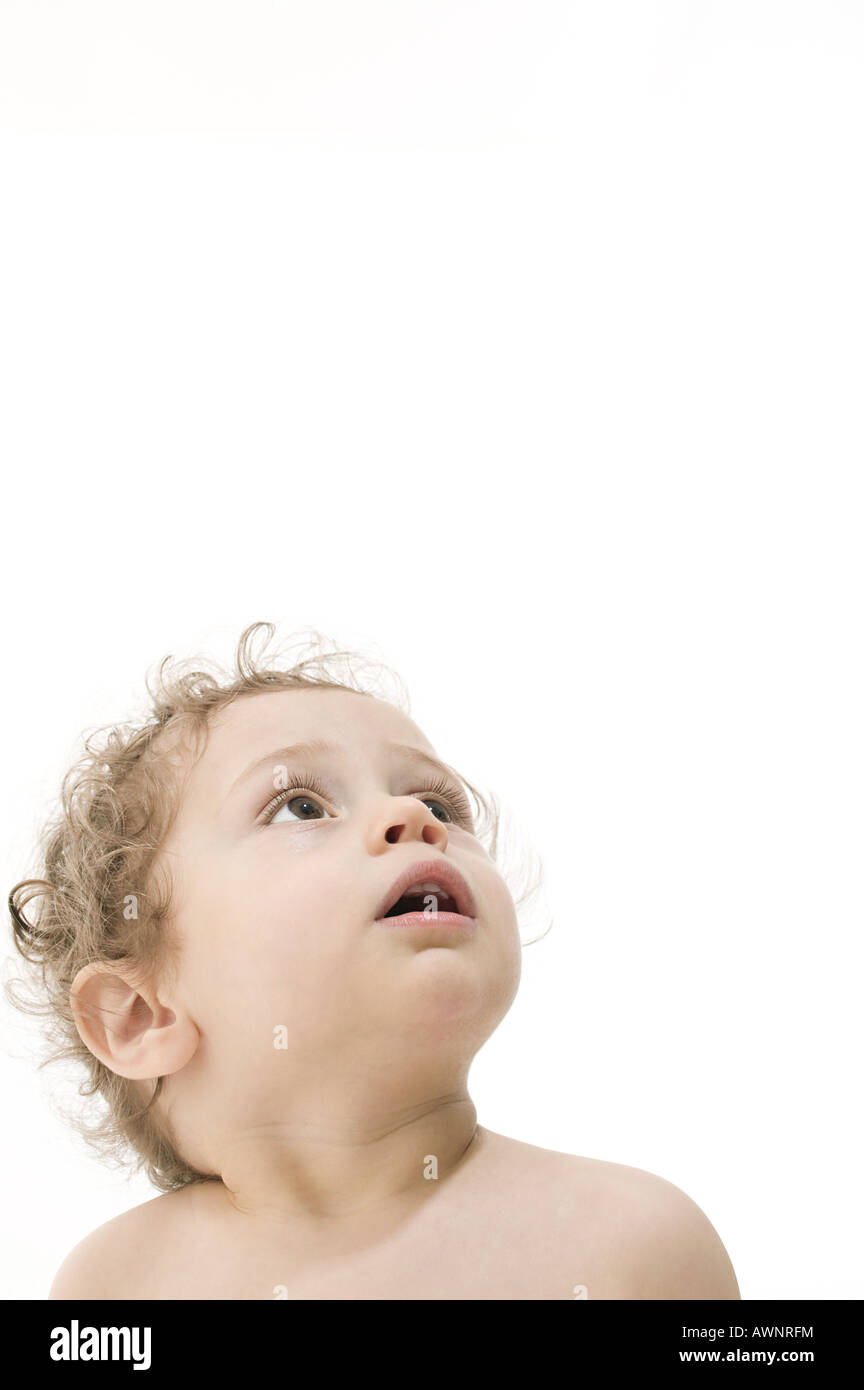 Baby boy looking up Stock Photo - Alamy