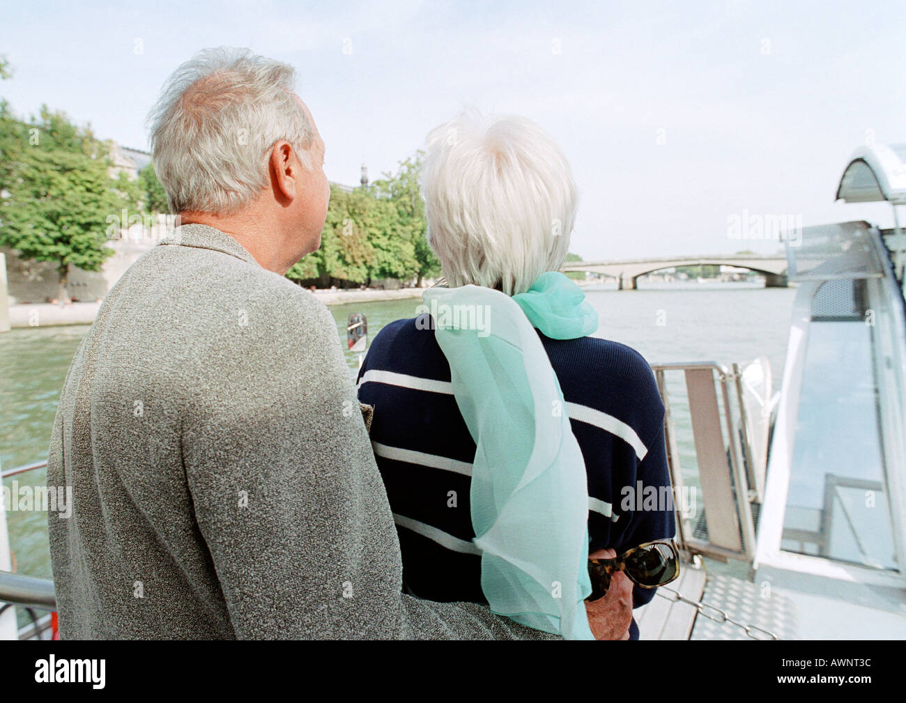 Mature man and woman on a boat, rear view Stock Photo - Alamy