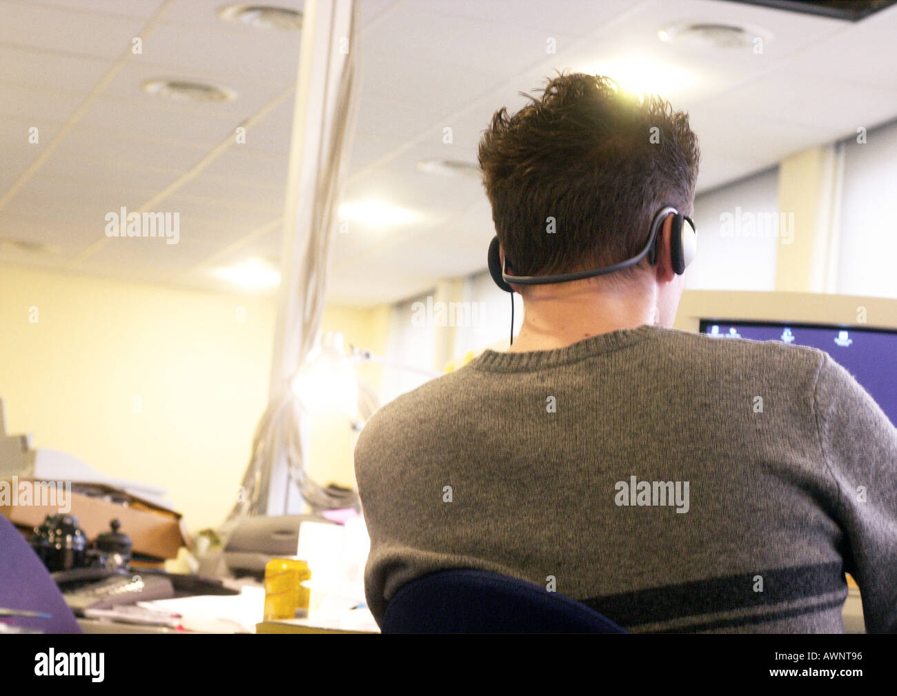 Rear view man wearing headphones hi-res stock photography and images ...