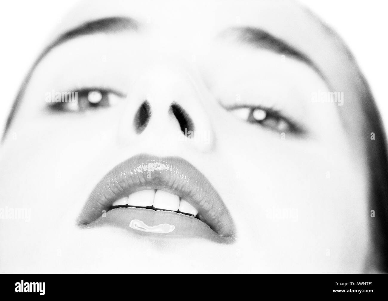 Woman's face, low angle view, looking at camera, close-up, B&W Stock ...