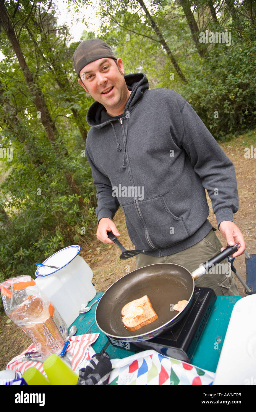 Man cooking outdoors Stock Photo - Alamy