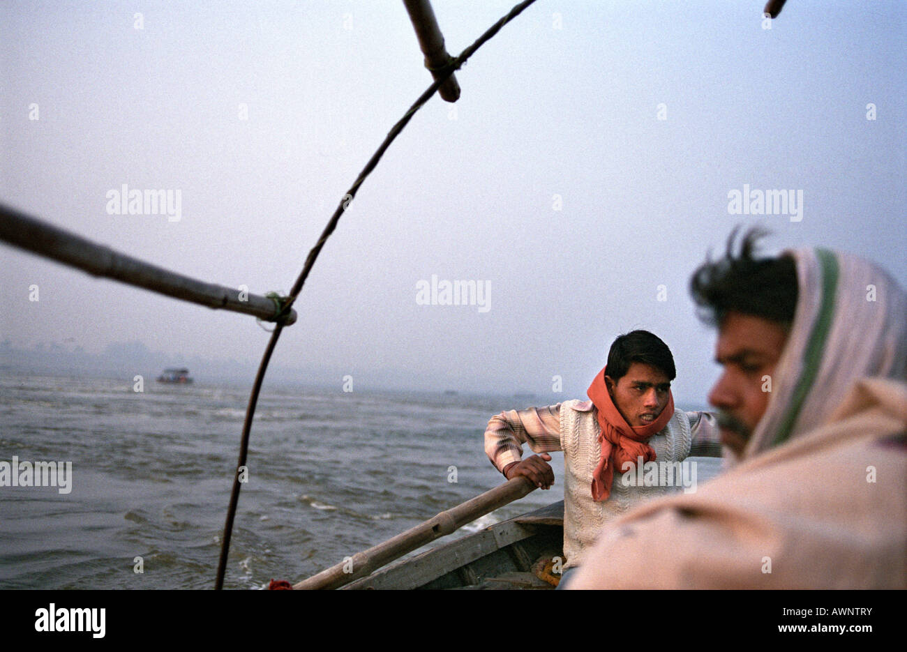 A group of Hindu pilgrims take a boat to the sacred Sangam, a Hindu ...