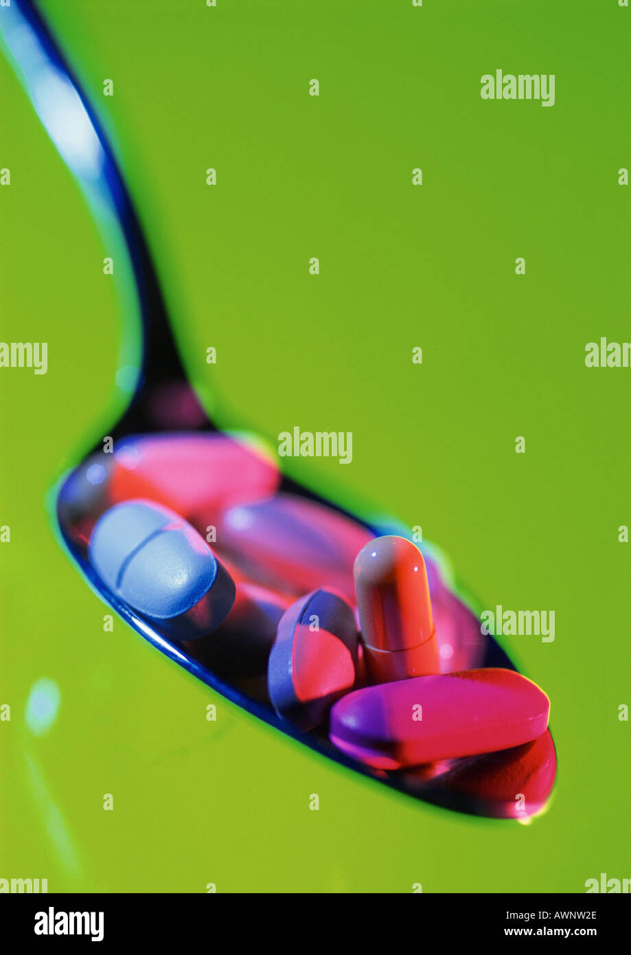 Spoon with colored tablets hi-res stock photography and images - Alamy