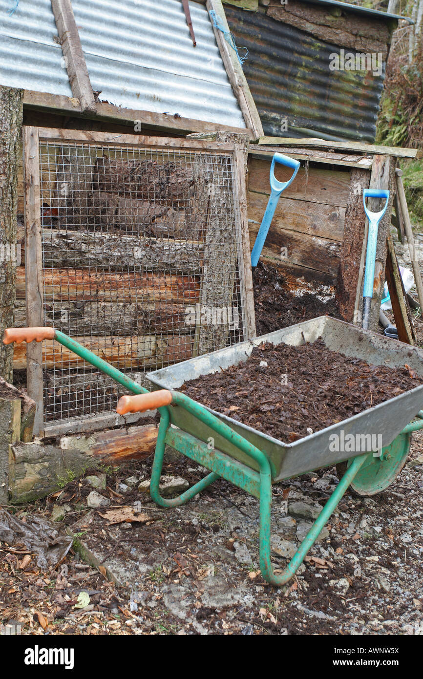 MAKING COMPOST COMPOST BIN AND SIEVED COMPOST IN WHEEL BARROW Stock ...