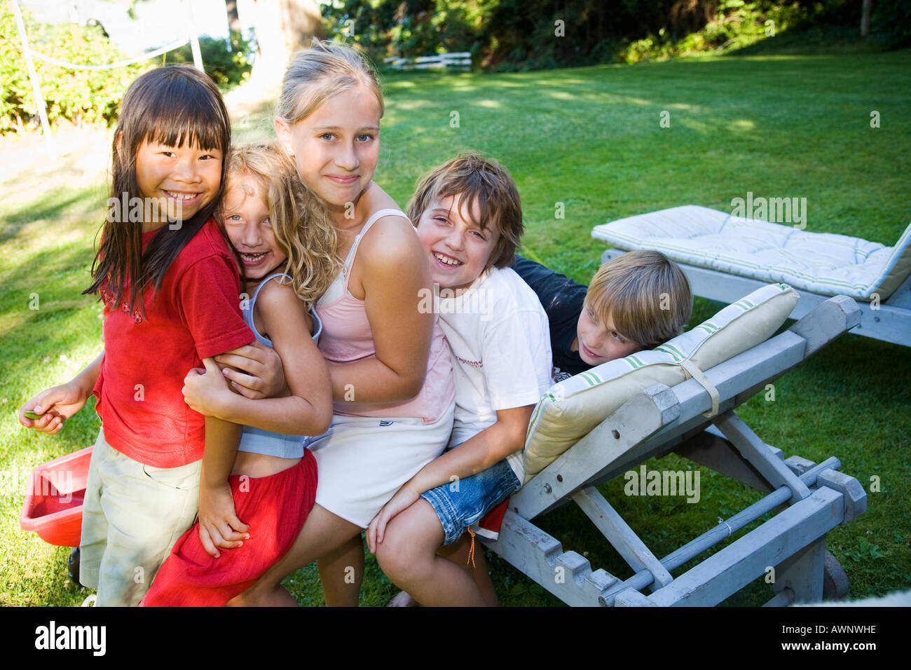 Children playing in the backyard Stock Photo - Alamy