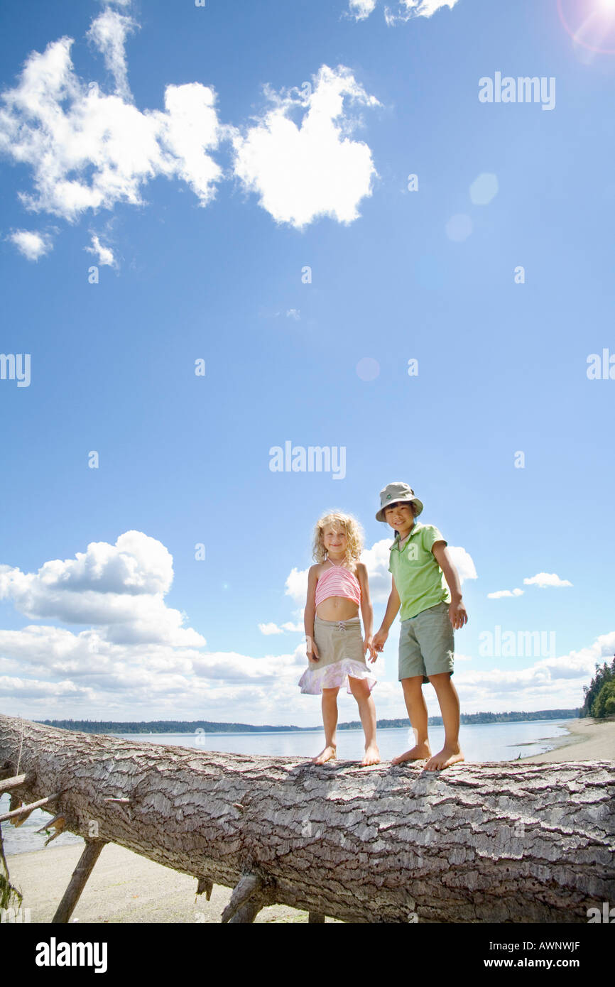 Children balancing on fallen tree hi-res stock photography and images ...