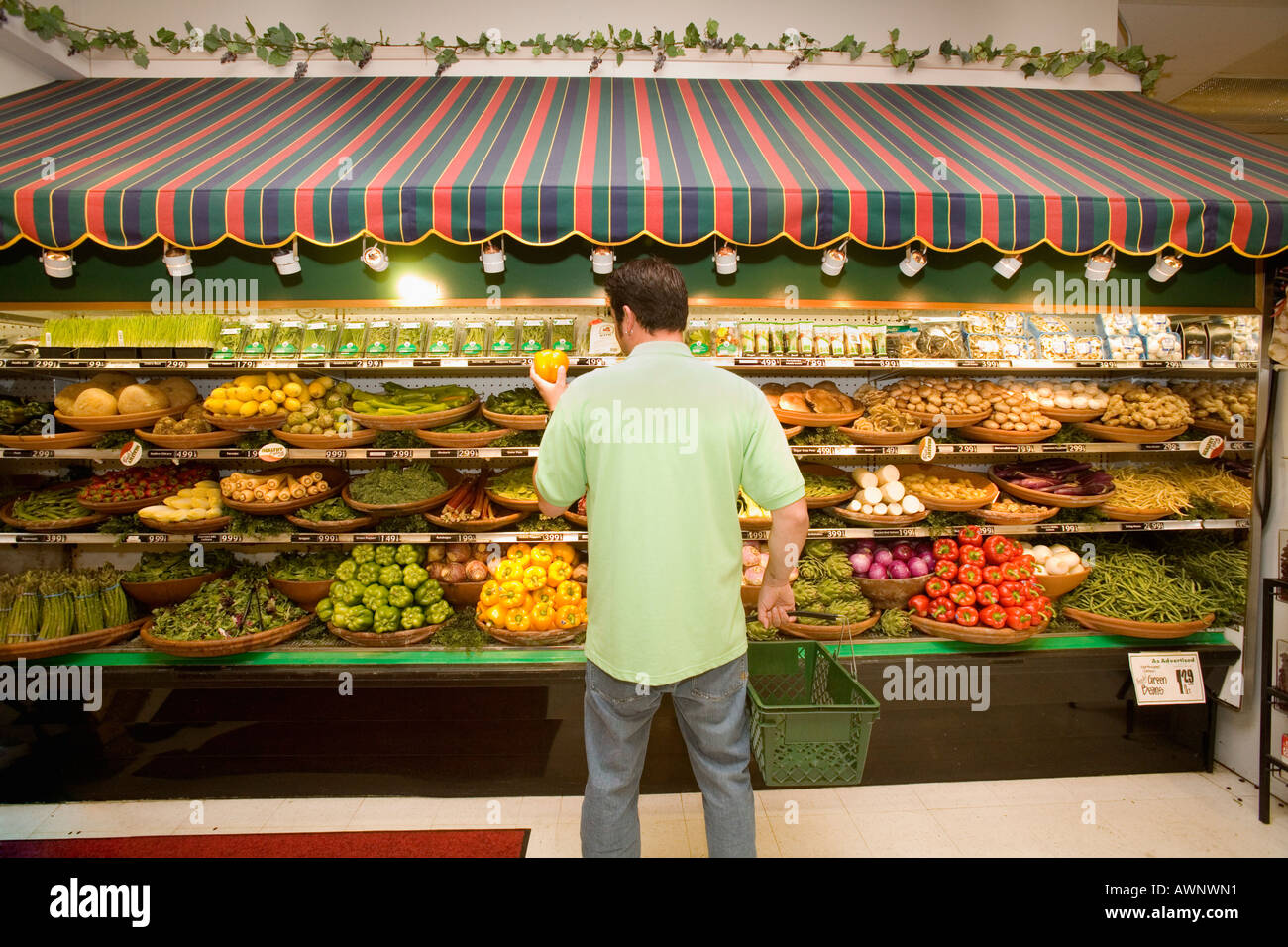 Man selecting produce in supermarket Stock Photo - Alamy
