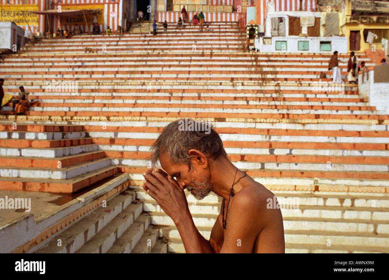 devotee praying at kedar ghat, varanasi, benares Stock Photo - Alamy