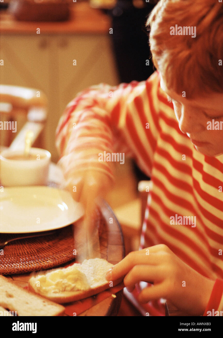 Boy eating bread spread hi-res stock photography and images - Alamy