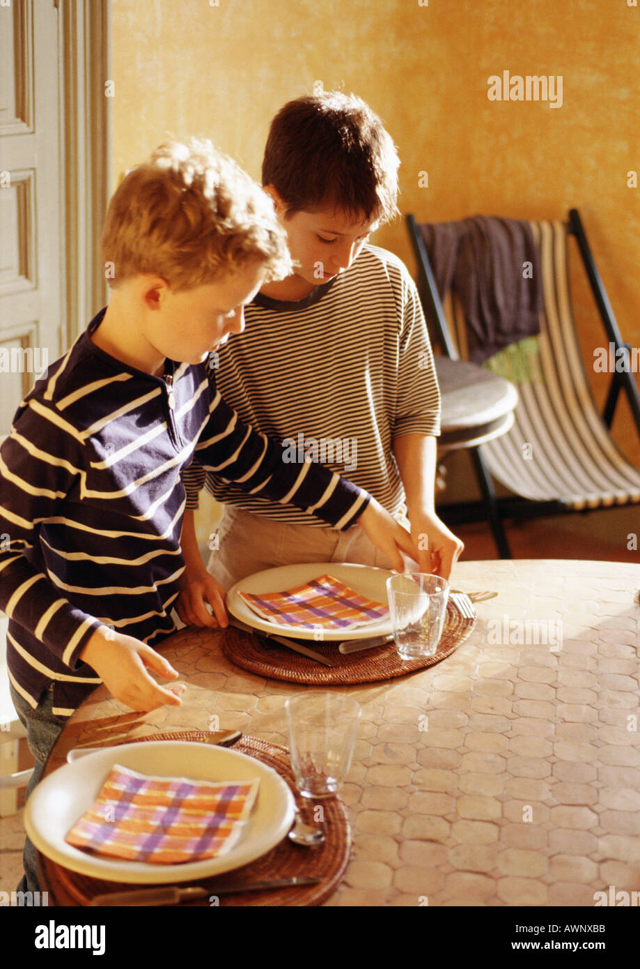 Children setting table Stock Photo - Alamy