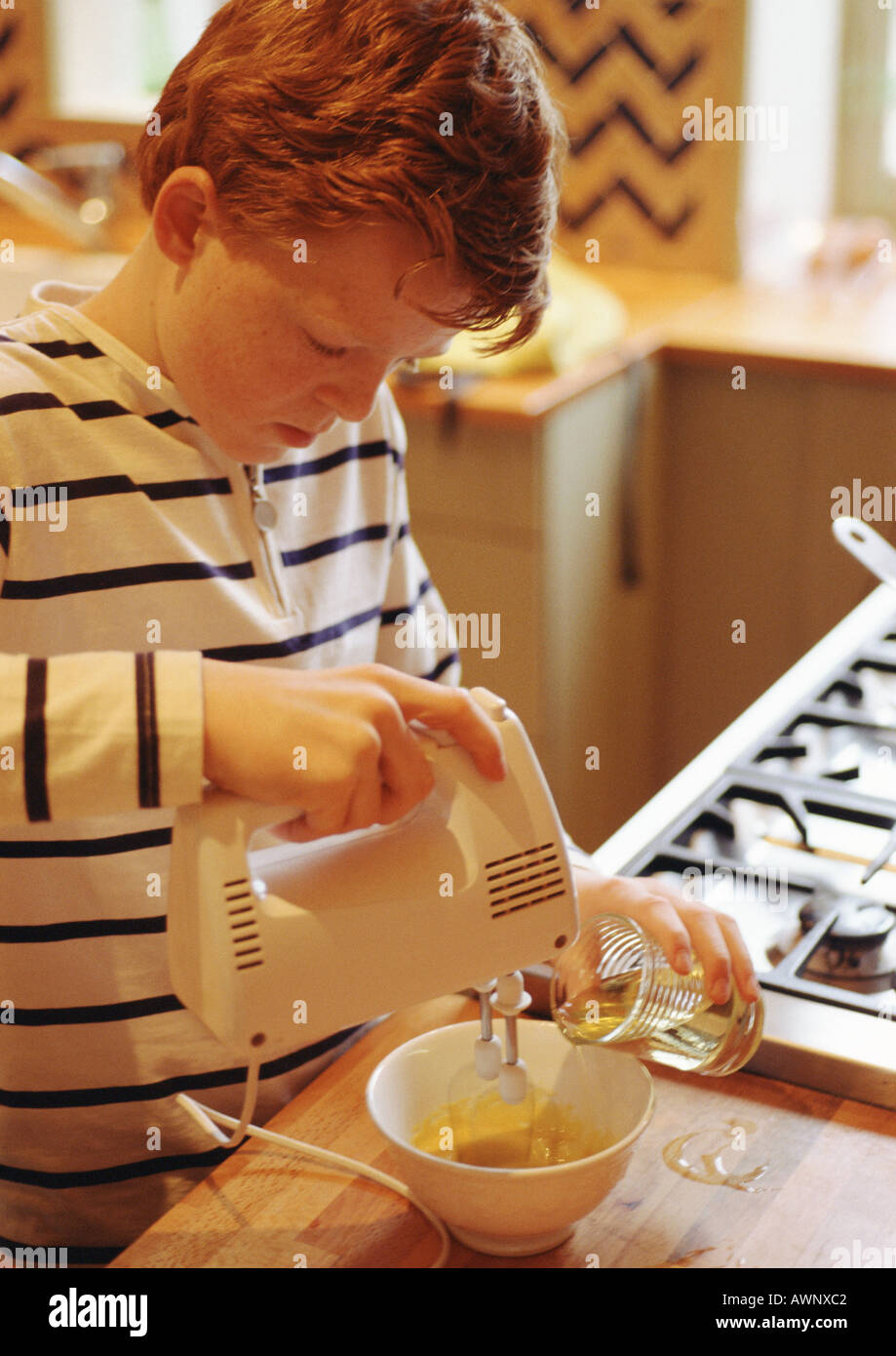 Person using electric food mixer hi-res stock photography and images ...