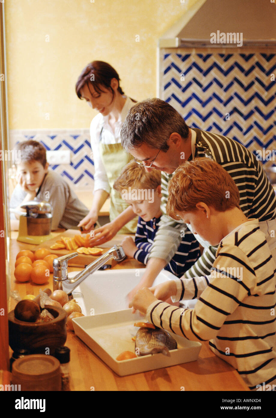 Family cooking in kitchen Stock Photo - Alamy