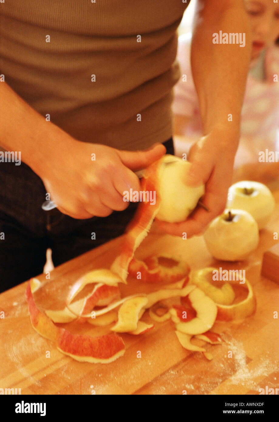 Hands peeling apples Stock Photo - Alamy