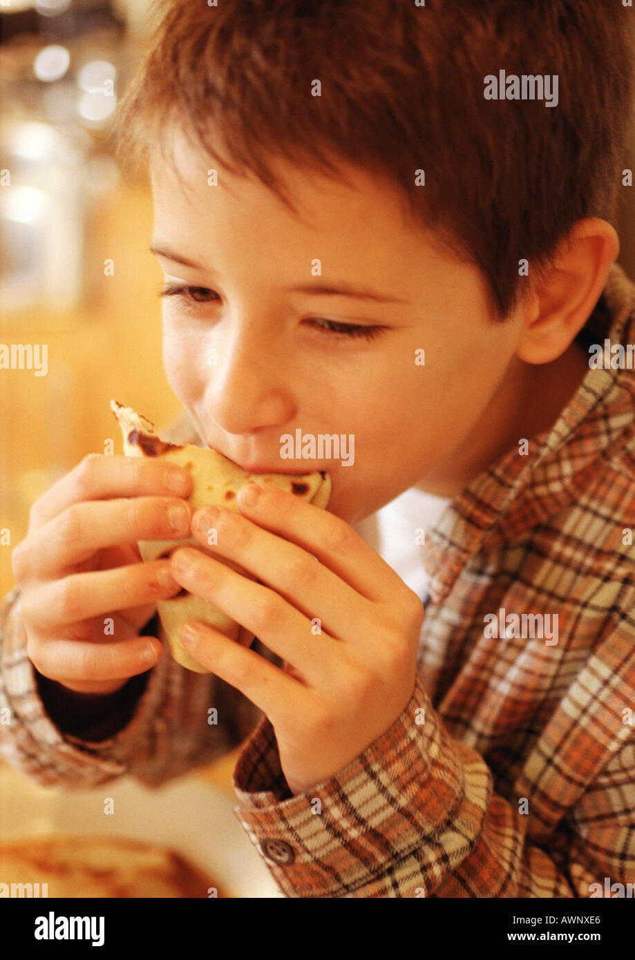 Child eating crepe, close-up Stock Photo - Alamy