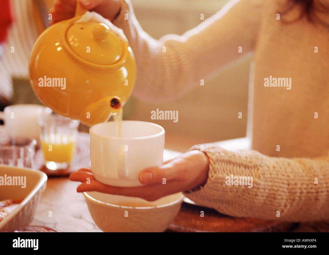 Woman pours tea from glass hi-res stock photography and images - Alamy
