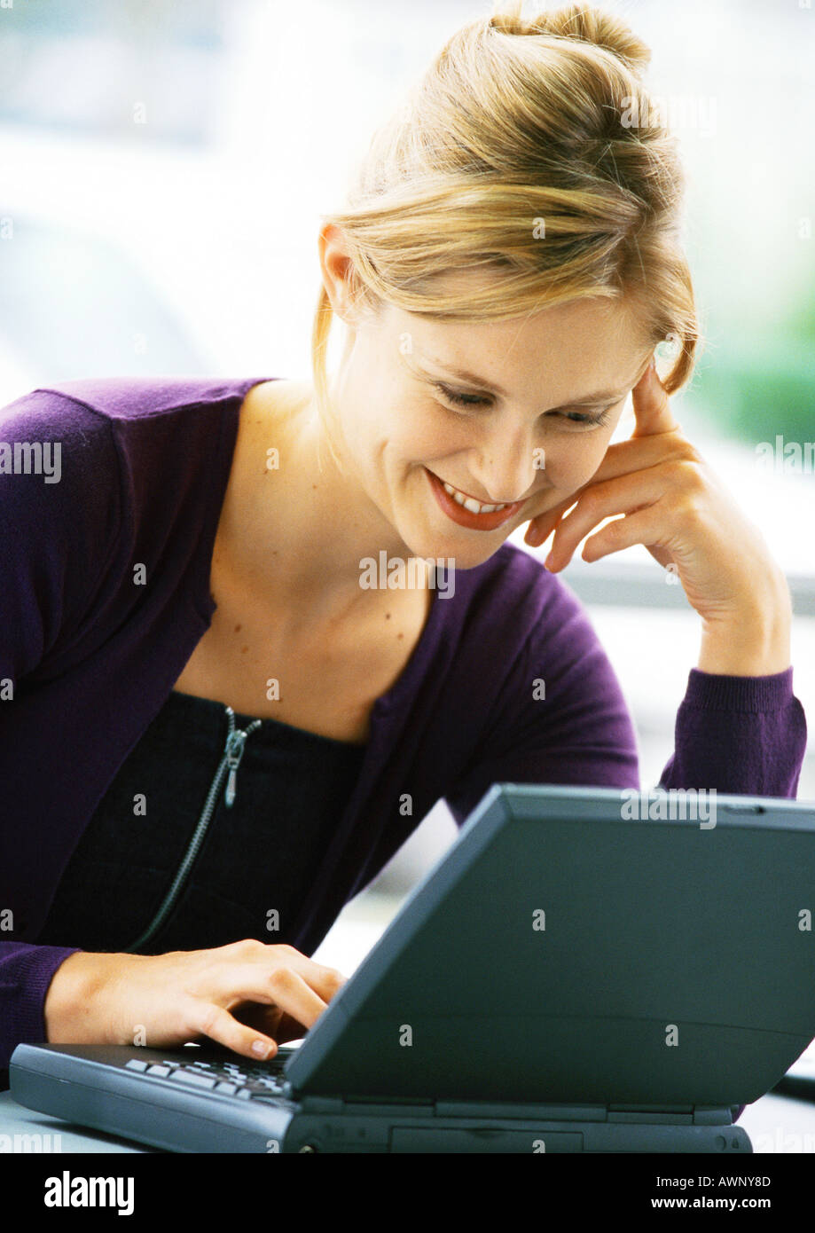 Woman with laptop computer, smiling Stock Photo - Alamy