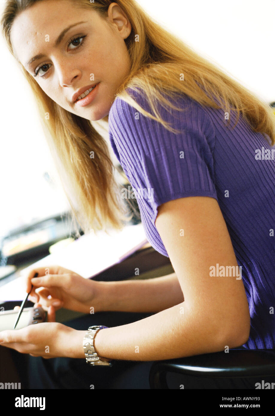 Woman using hand held computer, portrait Stock Photo - Alamy