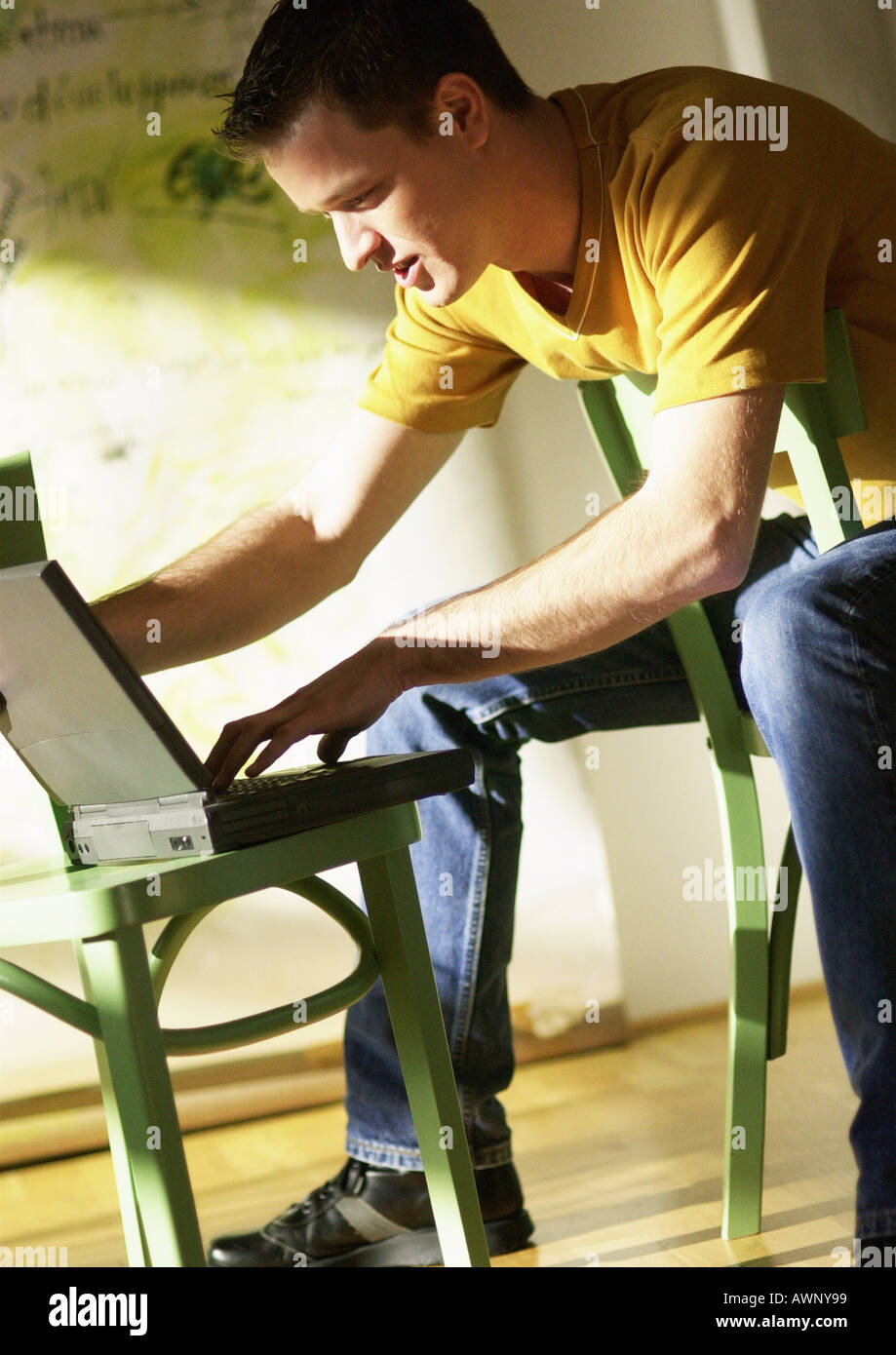 Man working on laptop computer Stock Photo - Alamy