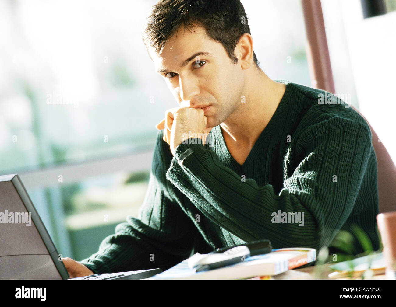 Man sitting at computer, portrait Stock Photo - Alamy