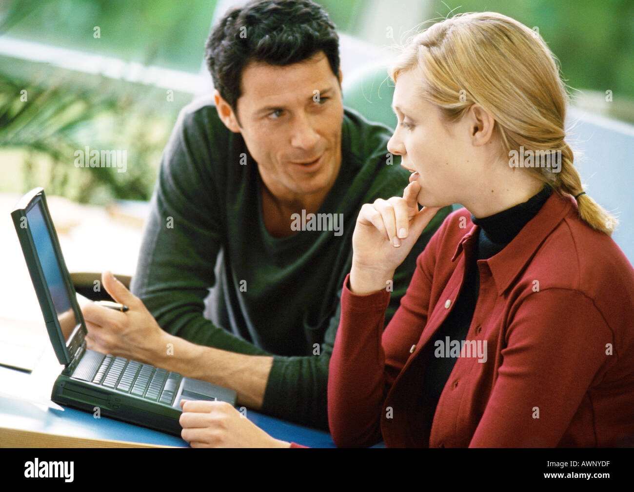 Colleagues sit using computers hi-res stock photography and images - Alamy