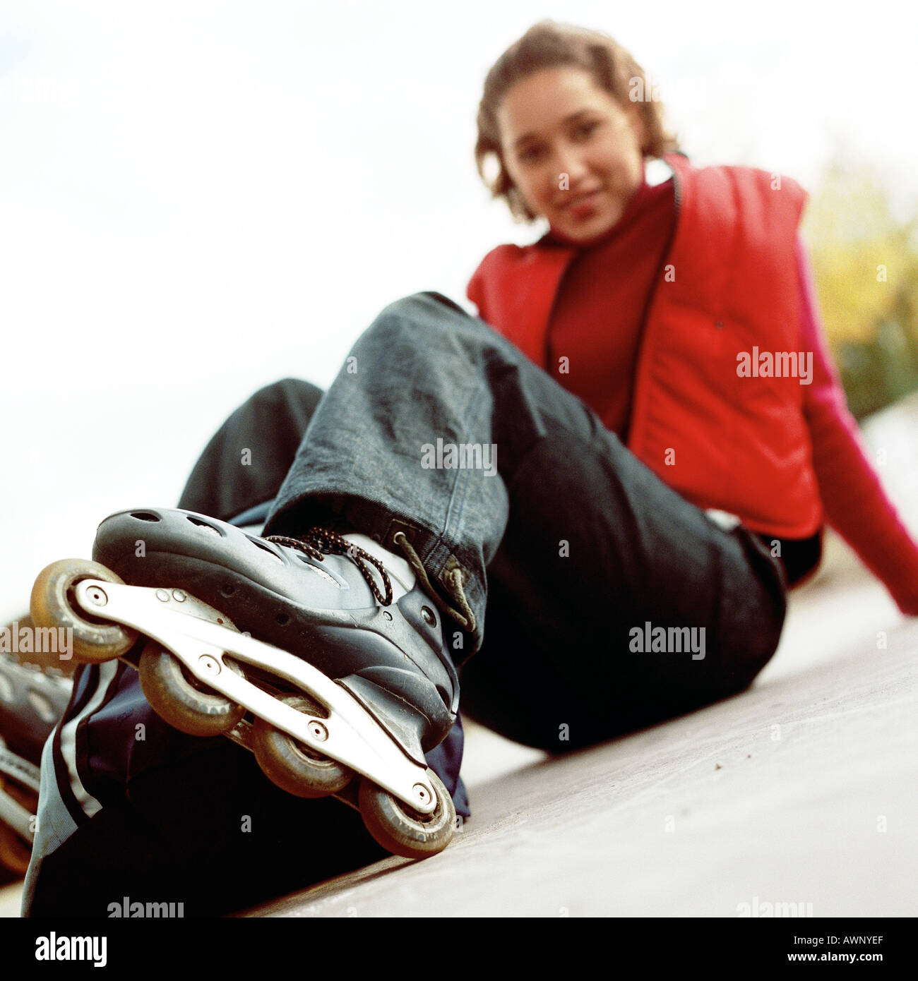Young woman wearing inline skates, portrait Stock Photo - Alamy