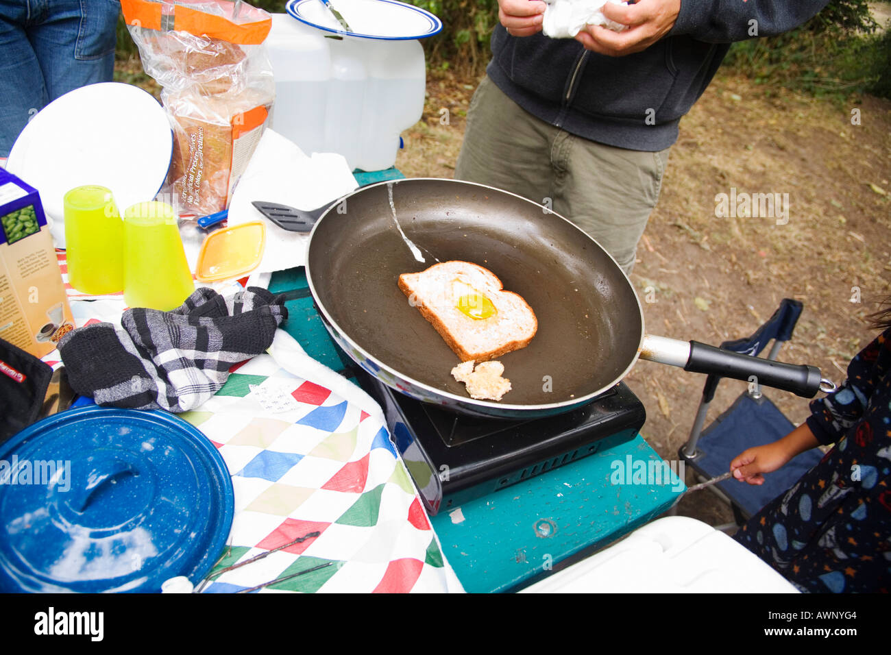 People cooking breakfast at campsite Stock Photo - Alamy