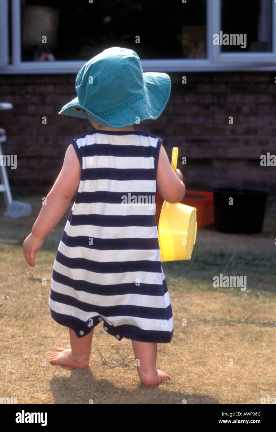 BACK VIEW BABY WALKING Stock Photo - Alamy