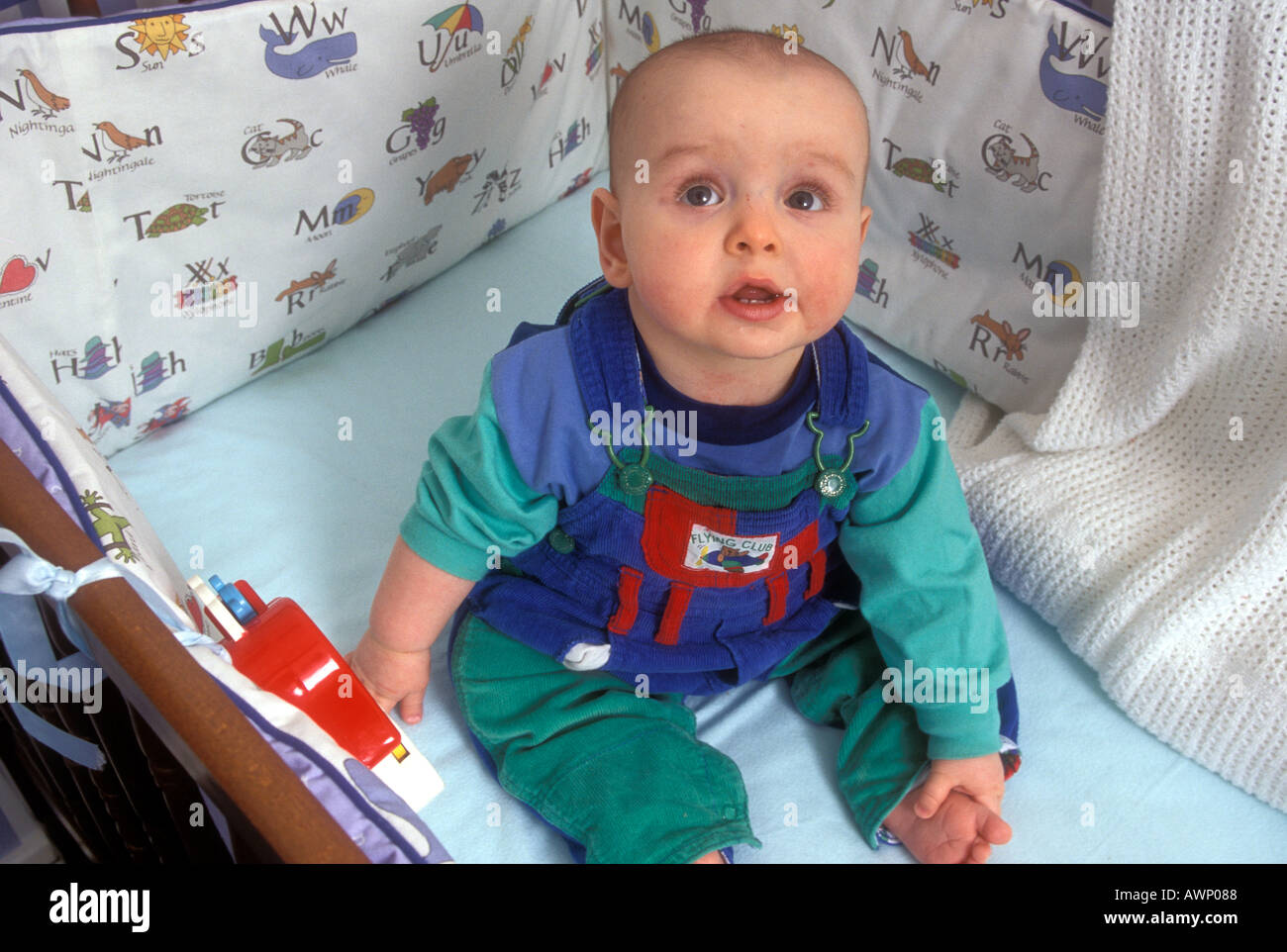 BABY IN COT Stock Photo - Alamy