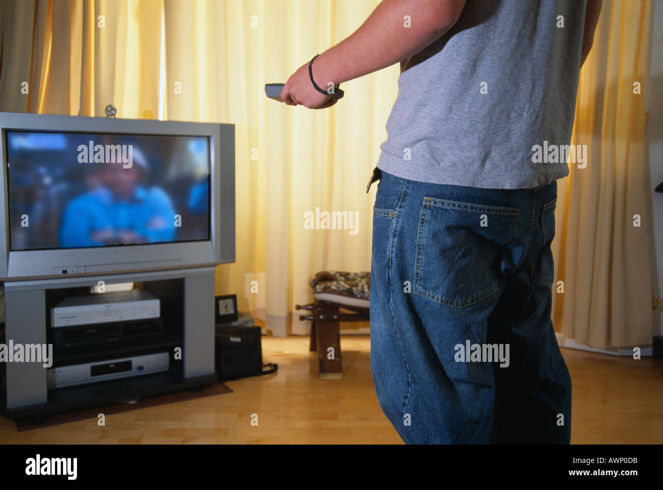 Remote control tv young hi-res stock photography and images - Alamy