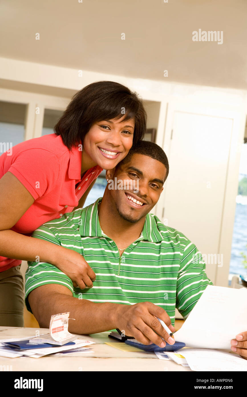Couple reading mail together Stock Photo - Alamy