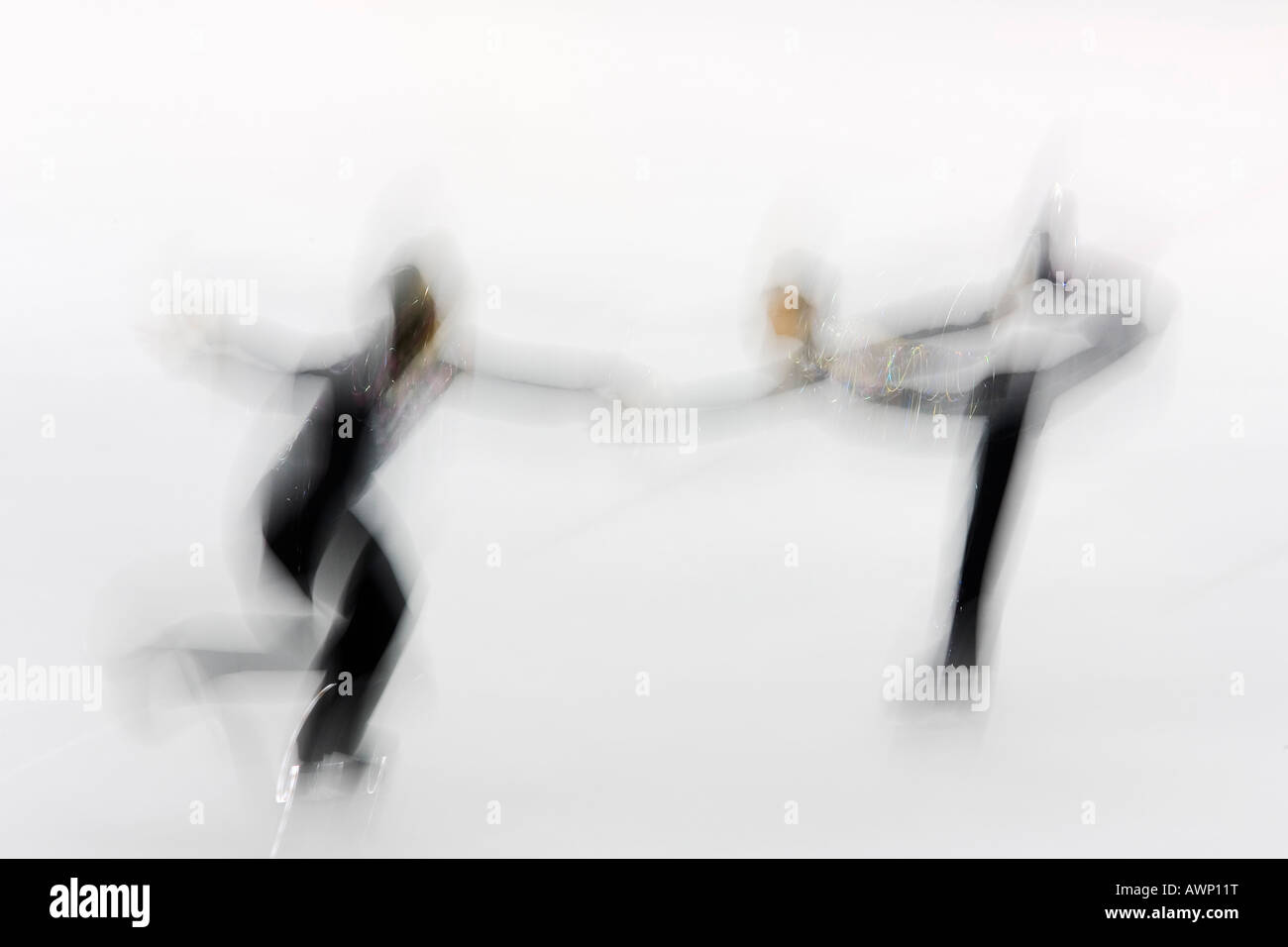 Blurred action of pairs figure skaters Stock Photo - Alamy