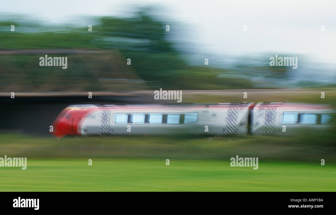 Train speeding through the countryside Stock Photo - Alamy