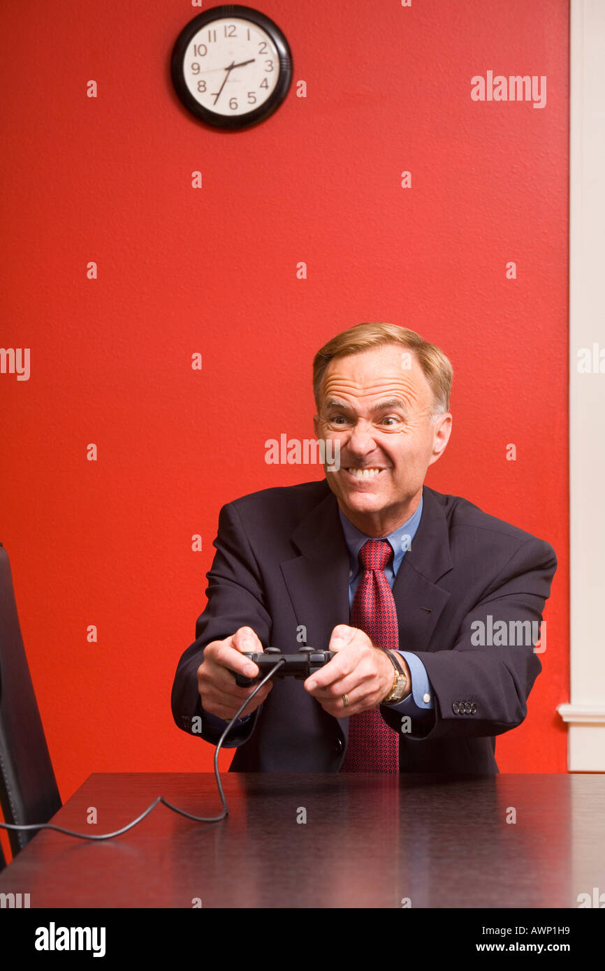 Businessman playing video games Stock Photo - Alamy