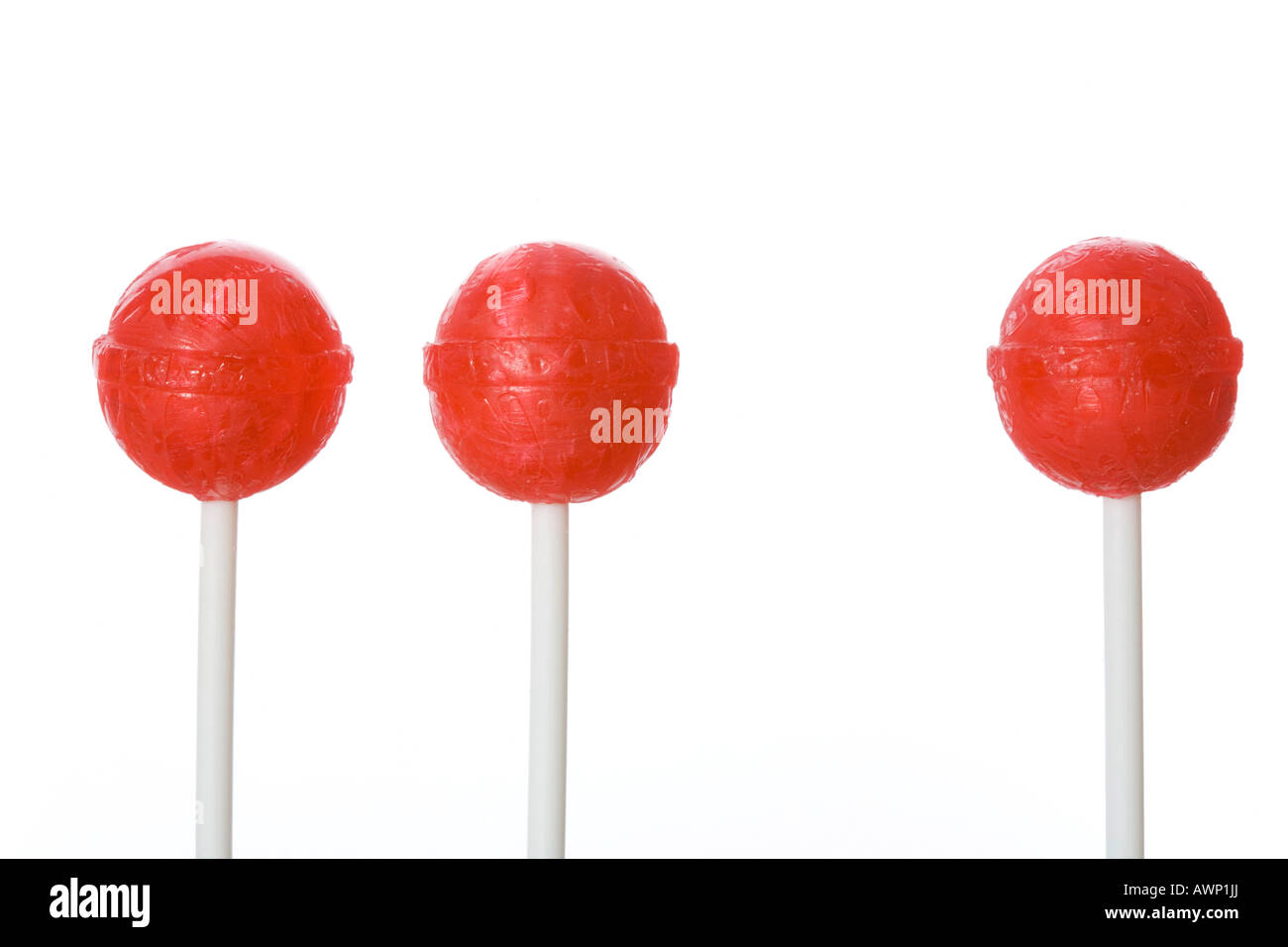 Three red Lollipops Stock Photo - Alamy