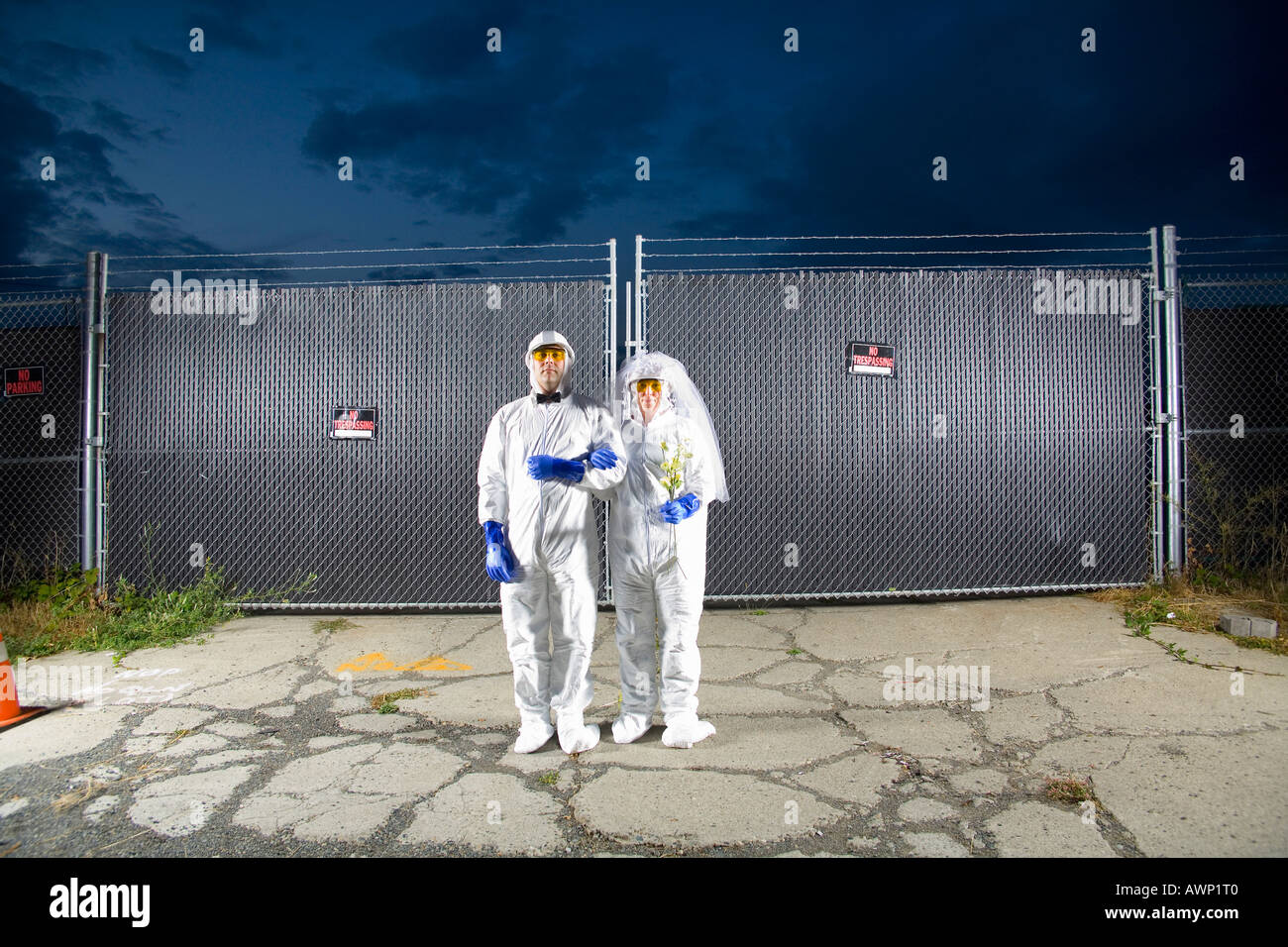People in biohazard suits standing outside security gate Stock Photo ...