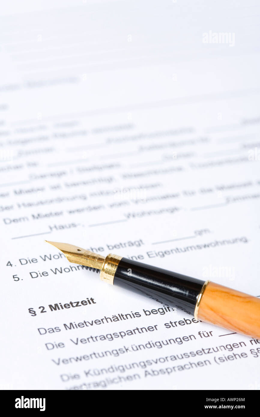 Fountain pen laying on top of a document Stock Photo - Alamy