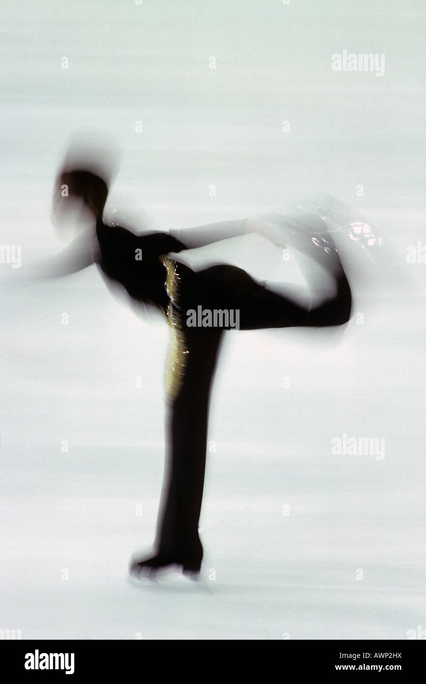 Blurred action of male figure skater Stock Photo - Alamy