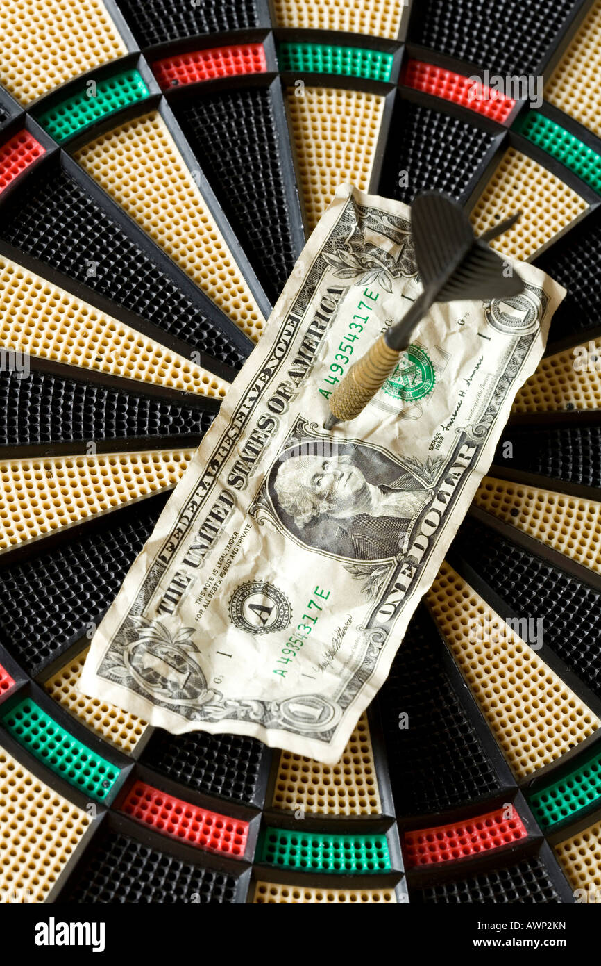 US dollar bill stuck to a dartboard Stock Photo - Alamy