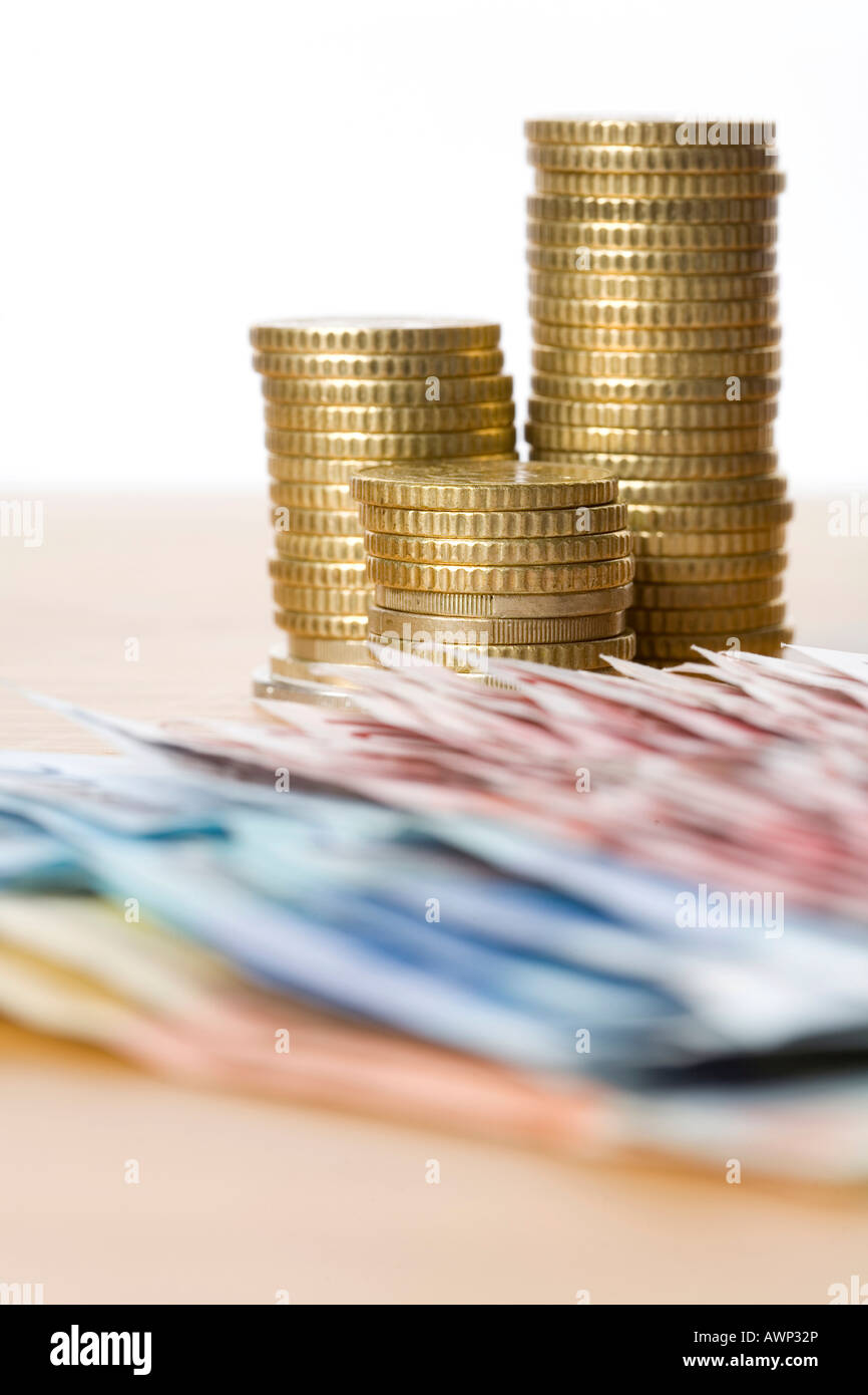 Stacked money, cash and coins (Euros Stock Photo - Alamy