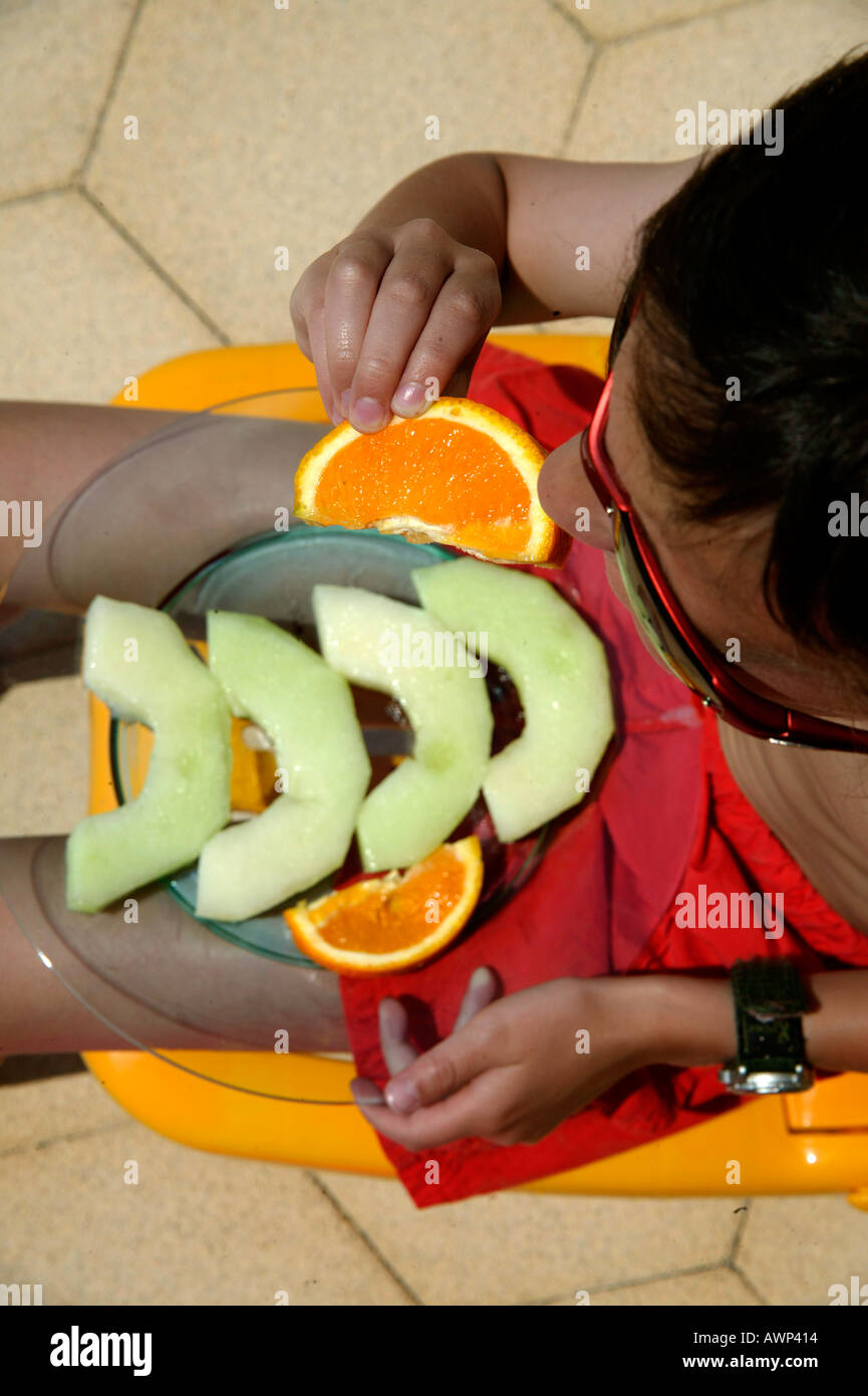 BOY EATING FRUIT Stock Photo - Alamy
