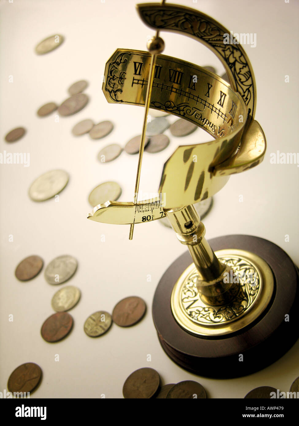 Sundial and Coins Stock Photo - Alamy
