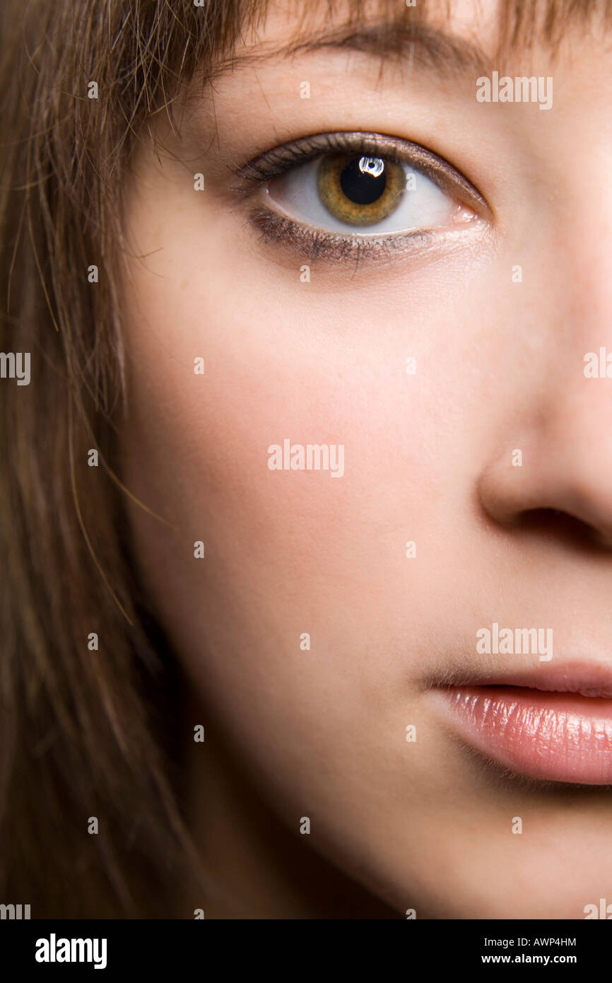 Left half of a young woman's face Stock Photo - Alamy