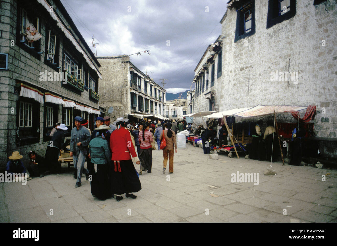 Barkhor area. Bazaar. Market. Men, women, old white buildings, stalls ...