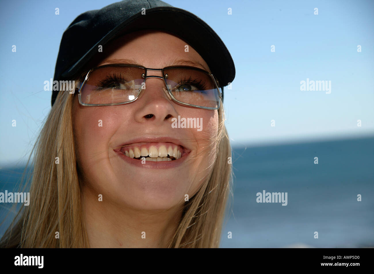 SMILING GIRL WEARING CAP Stock Photo - Alamy