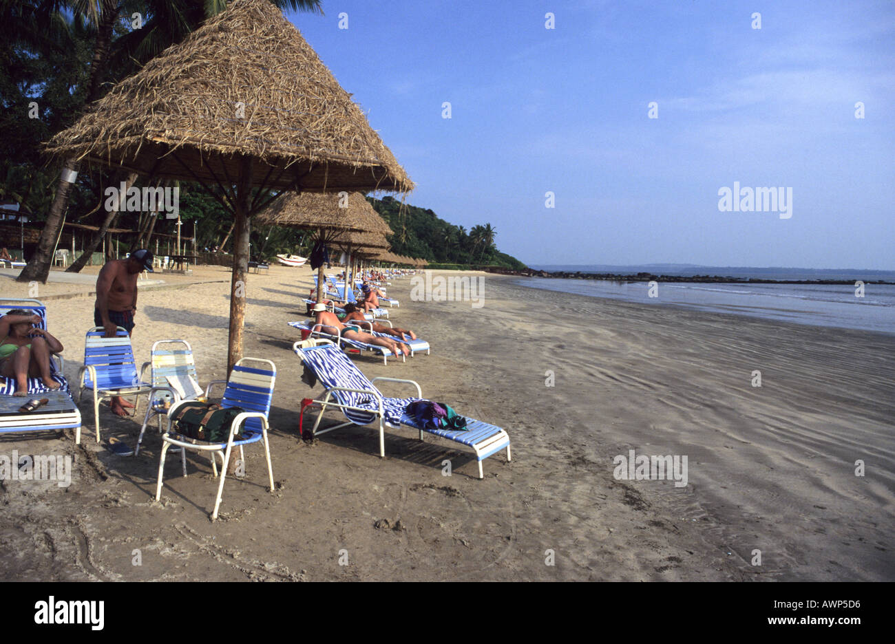 Tourists relaxing on beach beds hi-res stock photography and images - Alamy